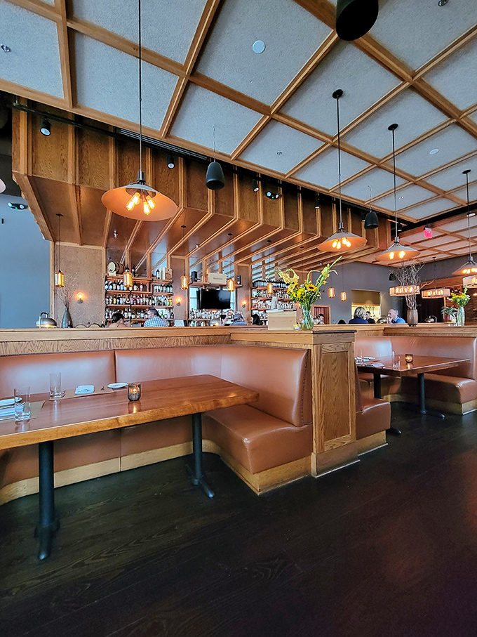 Warm wood tones, leather booths, and that geometric ceiling&mdash;this isn't your grandfather's steakhouse, but he'd approve nonetheless.