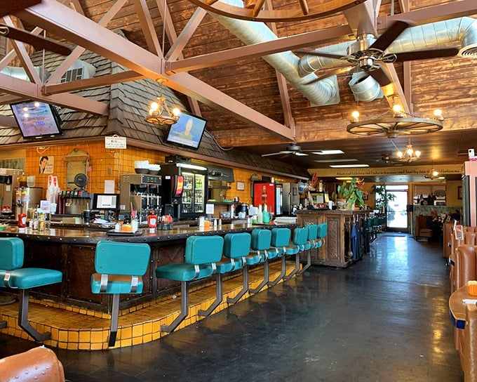 Step inside to discover soaring wooden beams and those iconic turquoise counter stools—where truckers, tourists, and locals unite in breakfast harmony.