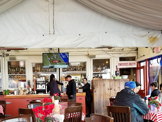 Inside, red-checkered tablecloths and wooden accents create that perfect "nautical casual" vibe where memories are made between bites of seafood perfection.