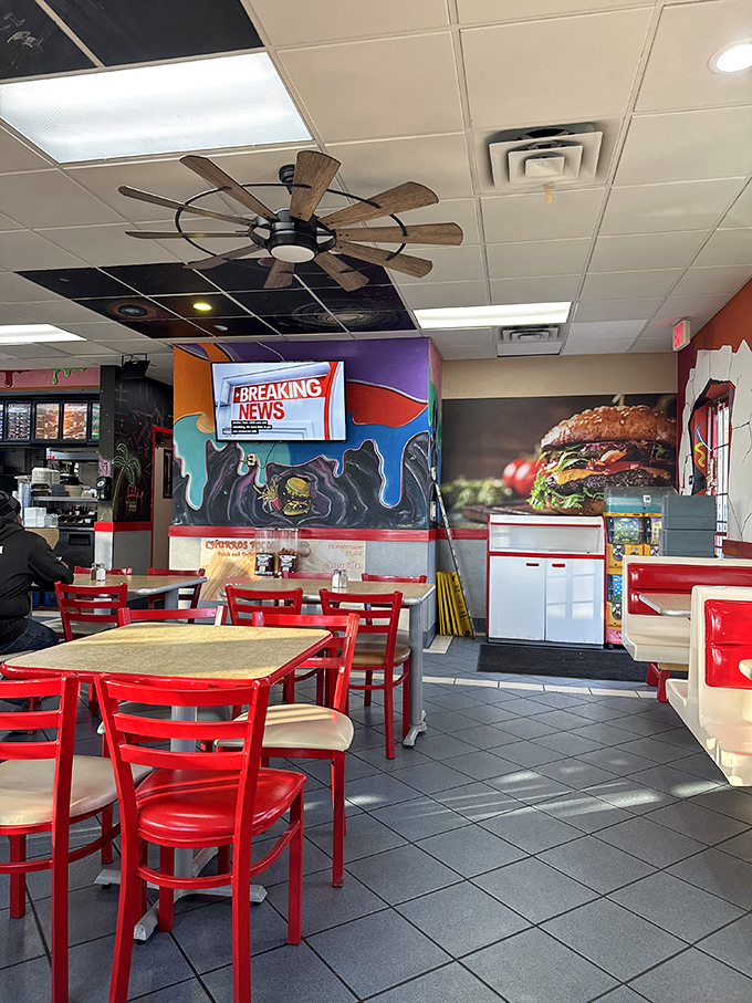 Inside, vibrant murals and that rustic windmill ceiling fan create the perfect backdrop for breakfast magic. Red chairs invite you to settle in for the main event.