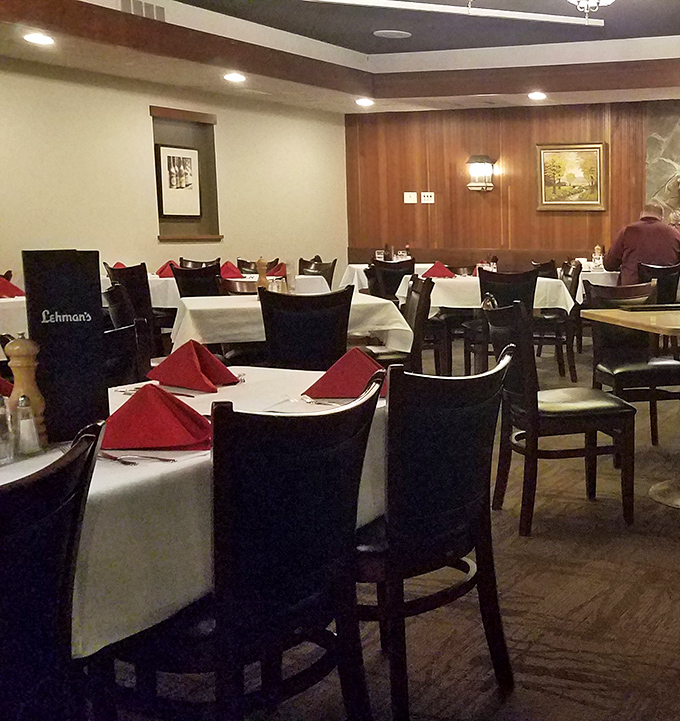 White tablecloths, wood paneling, and those perfectly folded red napkins&mdash;the dining room practically whispers "take your time, we've got all evening."