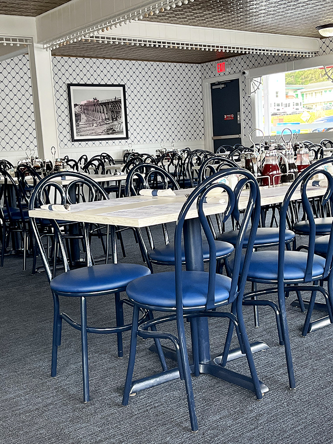 Blue chairs and white tables create the perfect canvas for serious breakfast conversations.