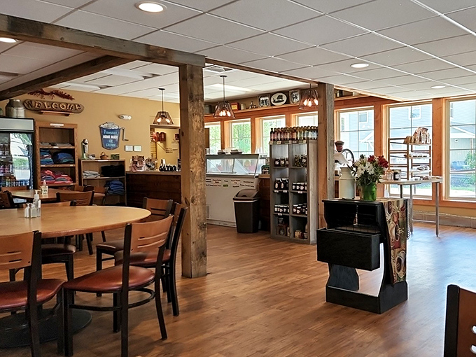 Rustic wooden beams meet modern comfort in this thoughtfully designed space. The warm tones and ample natural light create a welcoming atmosphere where lingering over coffee feels like a hometown privilege.