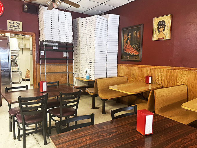 Pizza box towers stand sentinel in the dining room, a monument to takeout popularity and a visual promise of the deliciousness that awaits.