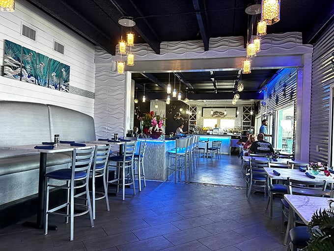 Step inside to a wave-inspired interior where ocean meets elegance. The undulating wall designs and ambient lighting create the perfect backdrop for seafood indulgence.