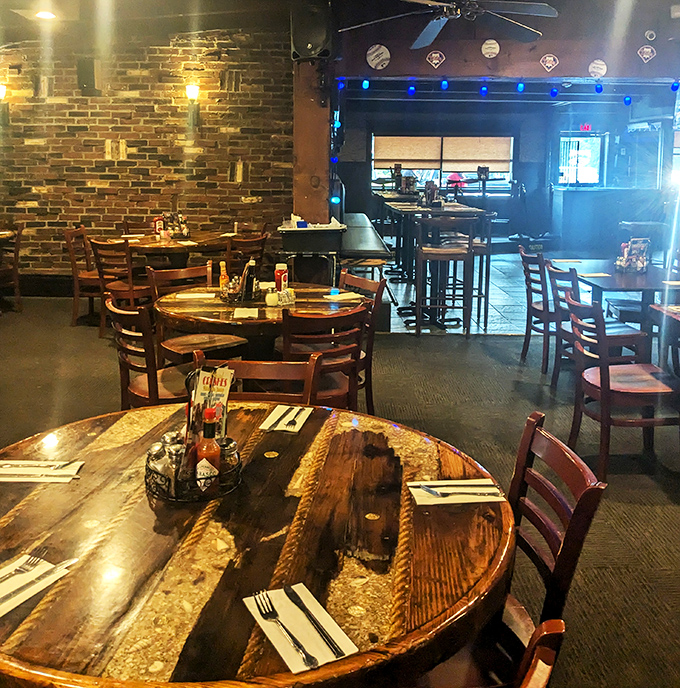 Rustic wooden tables and exposed brick walls create that perfect "everybody knows your name" atmosphere. The kind of place where memories are made between bites.