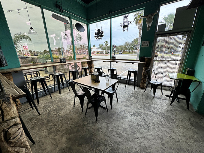 Turquoise walls and industrial seating create the perfect backdrop for the real star of the show—the food that's about to arrive at your table.