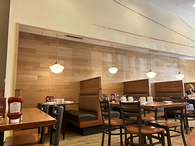 Warm wood tones and comfortable booths create that perfect "welcome home" vibe. Like your favorite aunt's dining room, if she were a breakfast wizard.