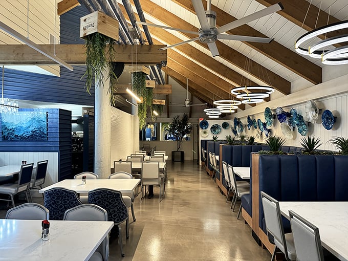 Nautical elegance meets Florida charm in this airy dining room, where blue accents and wooden beams create the perfect backdrop for seafood feasts.