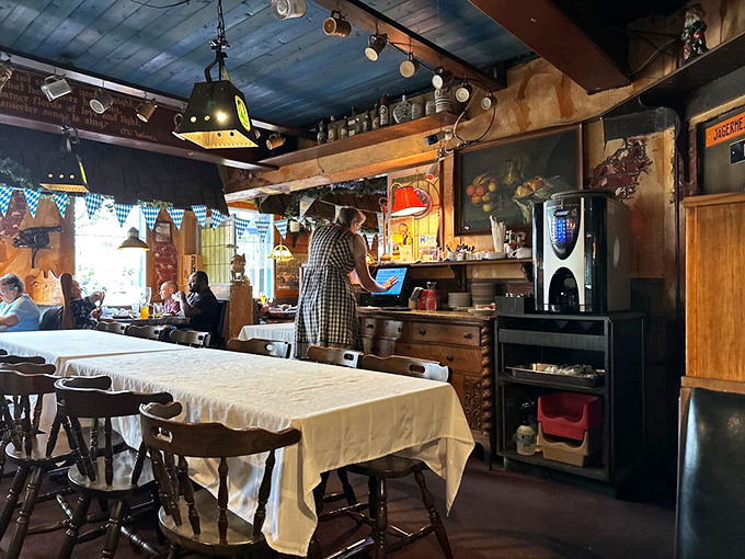 Step inside and time travel to a German grandmother's dining room. Blue ceiling planks, rustic wood, and white tablecloths create that unmistakable gemütlichkeit feeling.