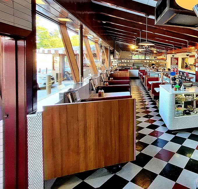 Step inside and the checkered floor announces you've entered the time-travel zone. These red booths have witnessed first dates, family celebrations, and countless "I'm-too-full-but-let's-get-dessert-anyway" moments.