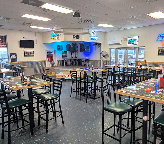 High-top tables, corrugated metal wainscoting, and beer signs create that perfect "everybody knows your name" vibe. Comfort starts before the food arrives.