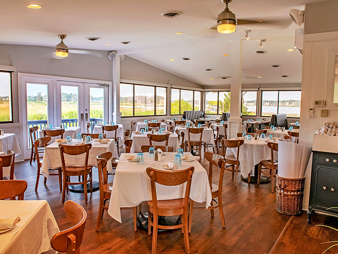 White tablecloths meet warm wooden chairs in this dining room where the marsh views compete with the plates for your attention.