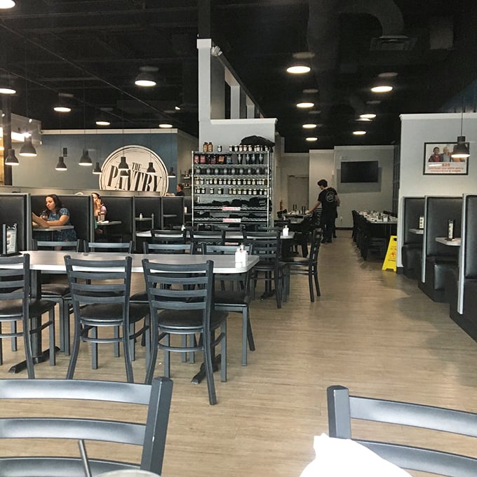 Modern meets comfort in this thoughtfully designed space. The blue accent wall and sleek booths create the perfect backdrop for morning revelations over coffee.