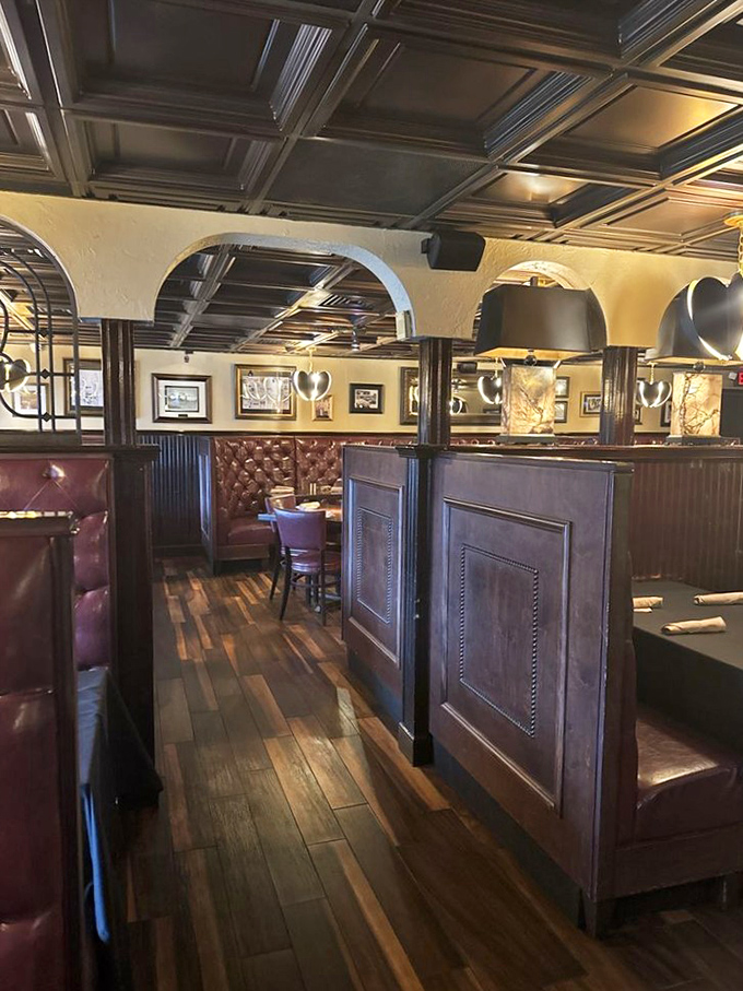 Rich burgundy booths and warm wood paneling create the kind of old-school steakhouse ambiance that makes you want to order a martini, even at lunch.