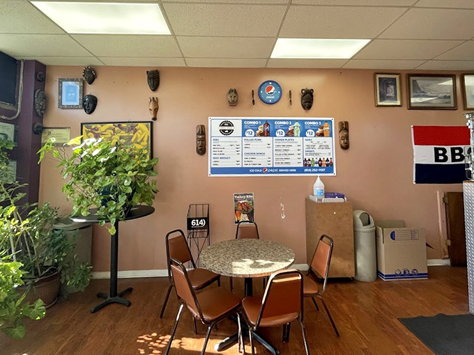 Inside, African masks and potted plants create a homey vibe where barbecue pilgrims gather. No fancy frills needed when the food does all the talking.