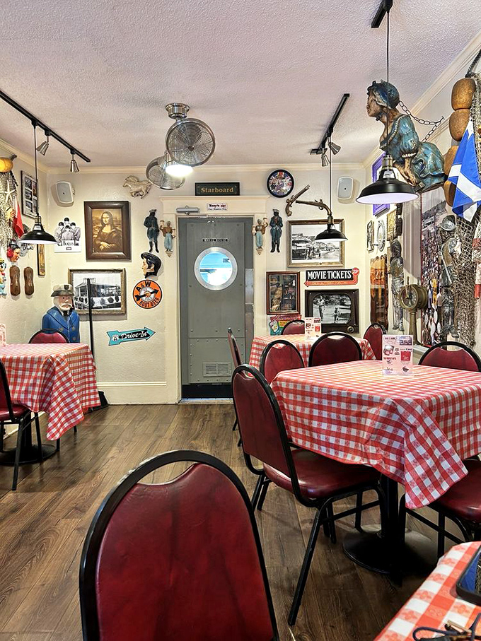 Nautical knick-knacks cover every inch of wall space, creating a maritime museum where the main exhibit is your appetite. The porthole door marked "Starboard" seals the deal.