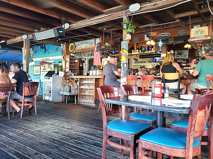 Where weathered wood meets waterfront views, Shrimper's bar area proves paradise doesn't need fancy marble countertops&mdash;just fresh seafood and cold drinks.