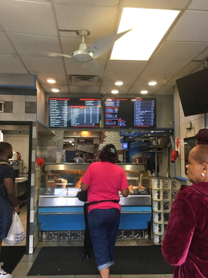 The ordering counter at Dwight's is where dreams begin and diets end. That menu board holds the roadmap to barbecue bliss.