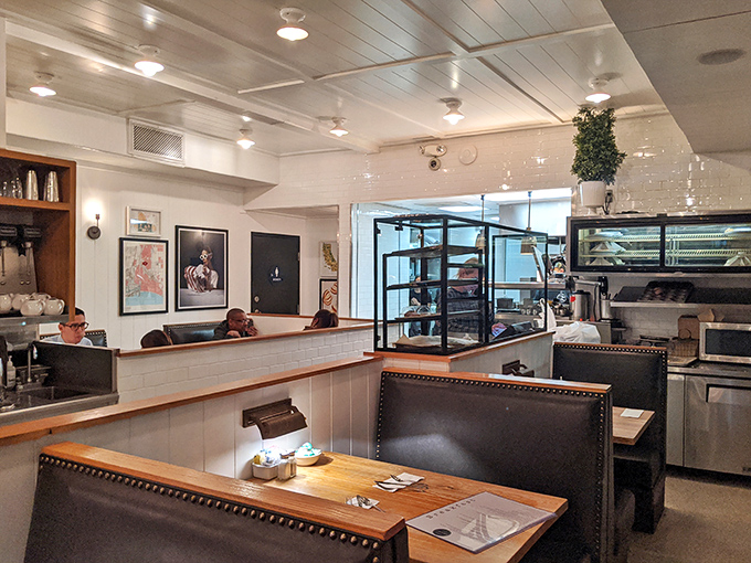 Cozy booths and counter seating where strangers become friends over coffee refills and the shared religion of comfort food.