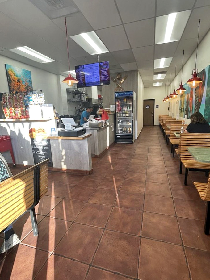 Simple wooden benches and coastal artwork create an unpretentious backdrop where the real stars&mdash;those magnificent lobster rolls&mdash;can shine without distraction.