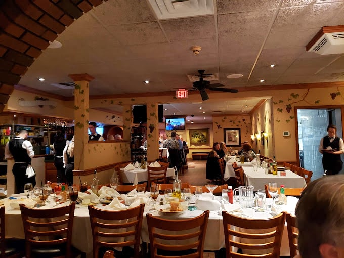 The dining room buzzes with that magical Italian restaurant energy&mdash;white tablecloths, warm lighting, and the promise of imminent carbohydrate bliss.