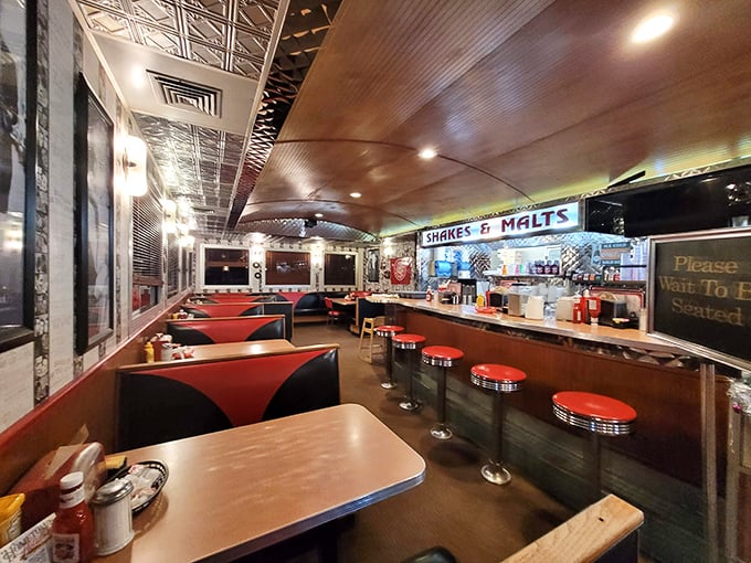 Step inside and you're transported to simpler times&mdash;red vinyl booths, counter seating, and that "Shakes & Malts" sign promising creamy delights ahead.