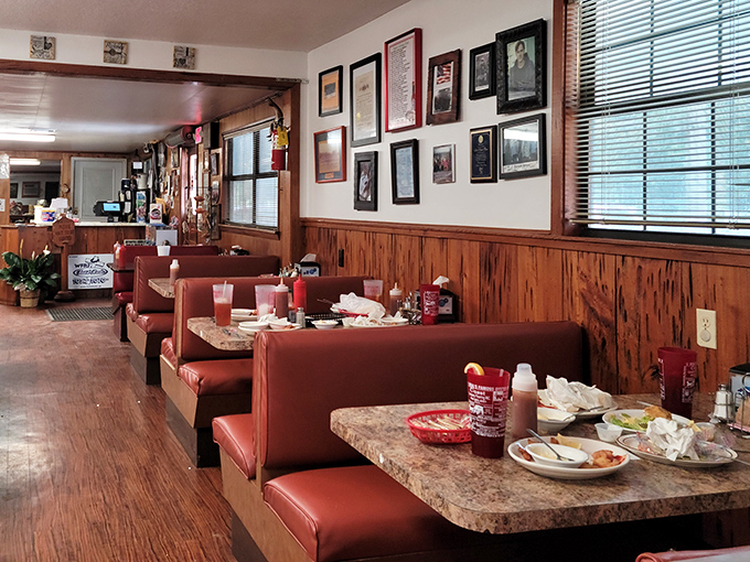 Red vinyl booths and maritime memories create the perfect backdrop for serious seafood conversations.