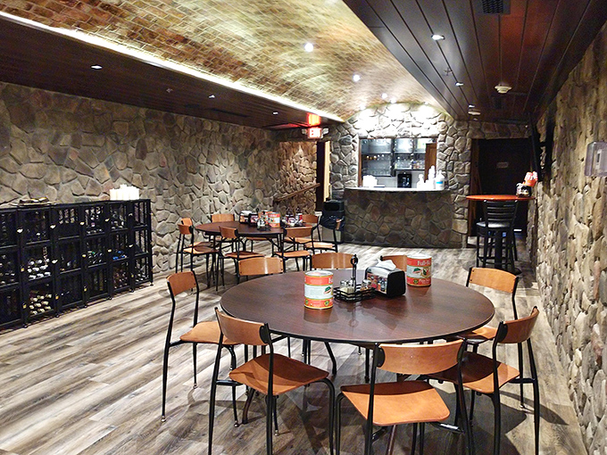Stone walls and exposed brick ceilings create a cave of culinary wonders where pizza dreams come true.