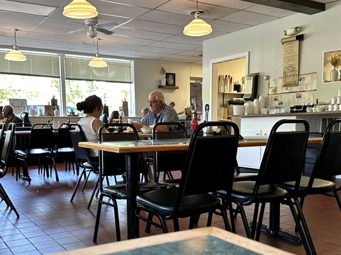 Simple tables, yellow pendant lights, and conversations that flow as easily as the coffee. This is where memories are made between bites.