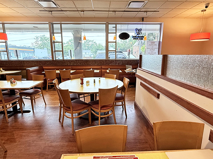 The dining room's warm wooden tones and comfortable seating create that rare atmosphere where you instantly feel like a regular, even on your first visit.