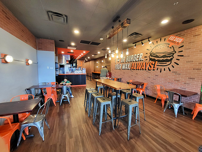 Industrial chic meets comfort food haven. That neon sign isn't lying&mdash;your burger, your way, always!