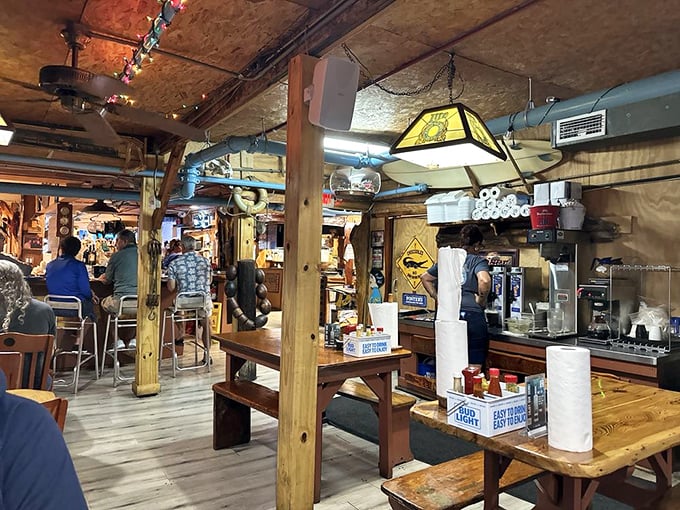 No interior designer was harmed in the making of this authentic fishing shack. Those wooden beams have witnessed more seafood stories than a fisherman's convention.