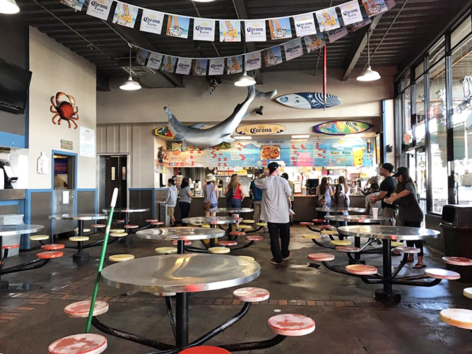 Colorful Corona banners and hanging fish set the festive mood. This isn't fine dining&mdash;it's fun dining, where memories are made between bites.