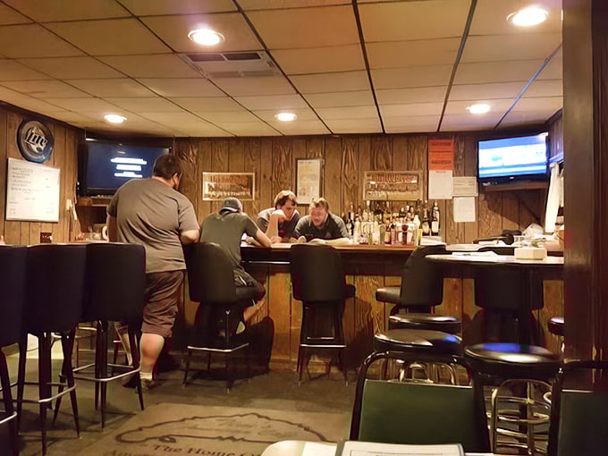 Wood-paneled walls and comfortable bar seating create that perfect "everybody knows your name" vibe where conversations flow as freely as the drinks.