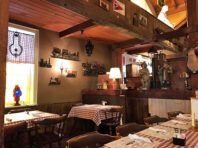 Red checkered tablecloths and warm wood create the perfect backdrop for serious comfort food conversations.