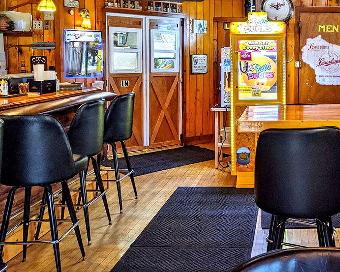 Wood paneling that whispers "comfort food ahead." This cozy interior feels like the cabin your luckiest friend owns&mdash;the one who can actually cook.