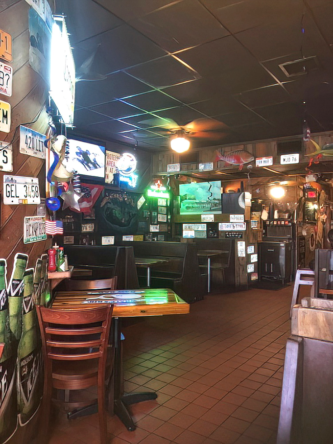 License plates from across America adorn wooden walls, telling the silent story of pilgrims who've made the journey for that perfect dolphin sandwich.