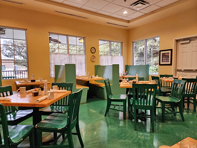 Inside, the green chairs and warm wood tones create that perfect "stay awhile" vibe where breakfast memories are made.