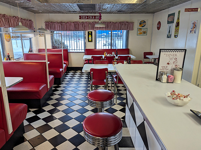Step inside to a checkerboard wonderland where fire-engine red vinyl booths and chrome stools promise the comfort of nostalgia with every perfectly plated meal.