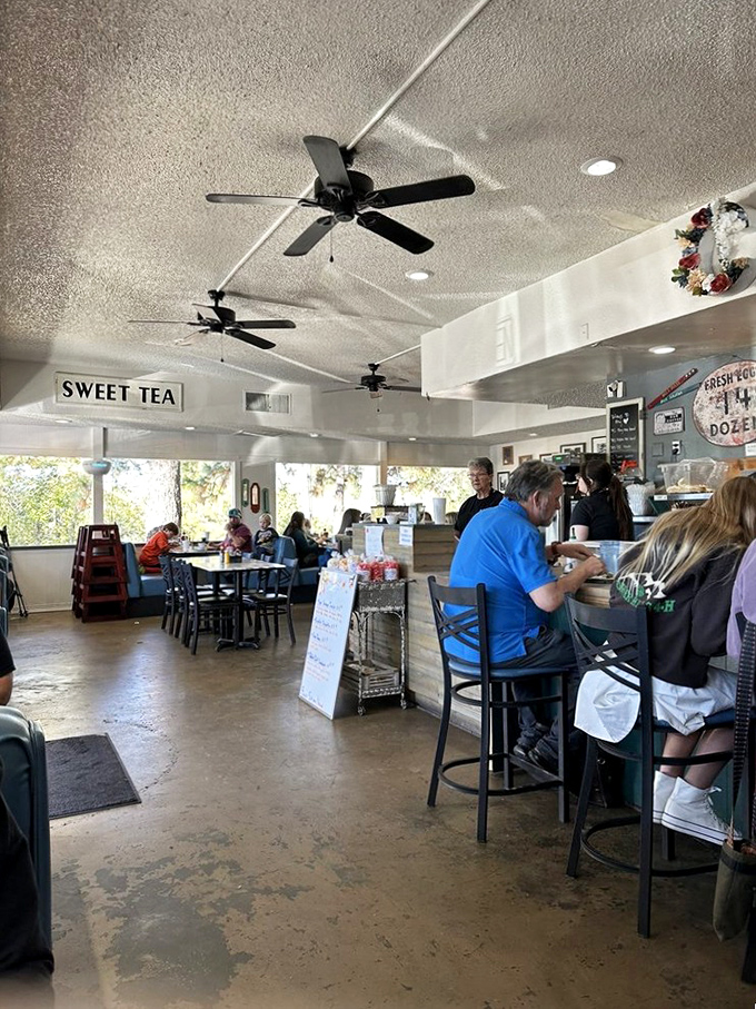 Inside, ceiling fans lazily spin above a bustling diner where sweet tea signs and the symphony of clinking plates create that perfect breakfast ambiance. Comfort starts here.