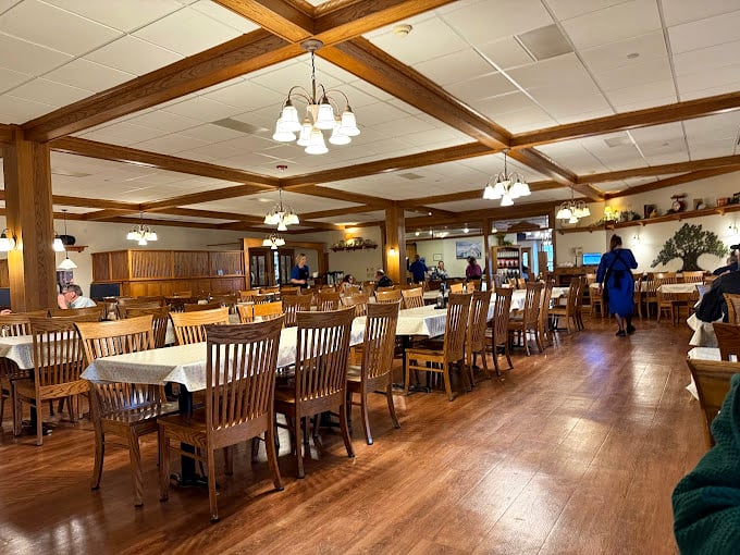 Wooden beams, warm lighting, and sturdy chairs create the perfect backdrop for conversations that linger longer than the dessert menu.