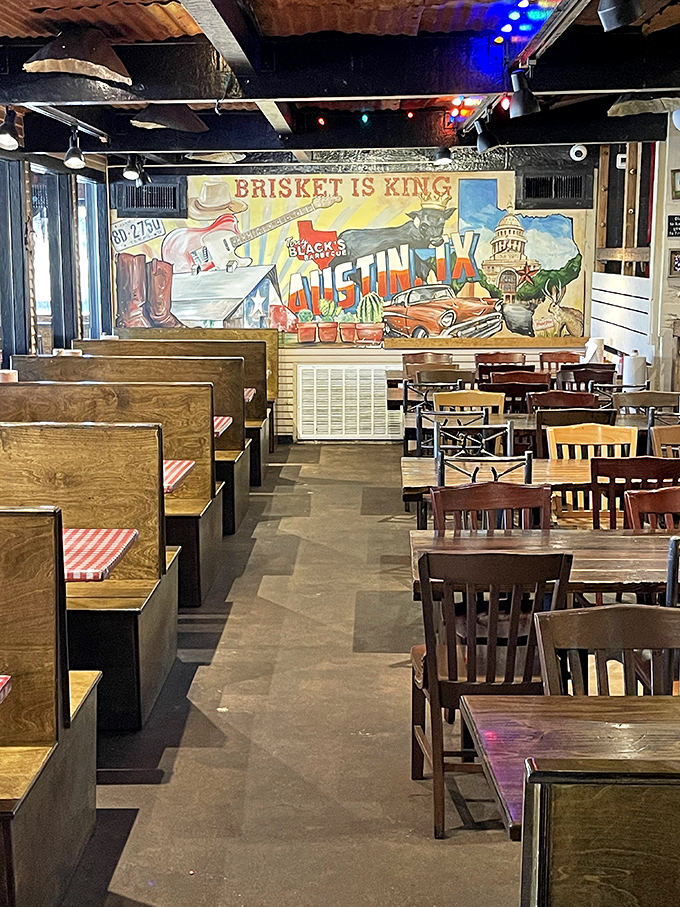 Wooden booths, simple chairs, and a mural declaring "Brisket is King." This dining room isn't trying to impress with decor&mdash;it's saving all the drama for your taste buds.