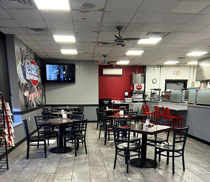 No-frills dining at its finest&mdash;red accents, simple tables, and the promise of sandwich perfection. The real decoration here is what arrives on your plate.