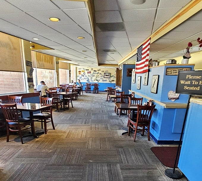 Step inside to a world where comfort reigns supreme &ndash; blue walls, wooden chairs, and an American flag that says, "Yes, we take breakfast seriously around here."