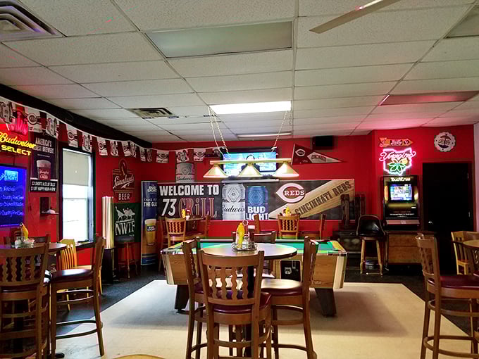 Step inside where red walls and wooden chairs create the perfect backdrop for serious sandwich conversations.