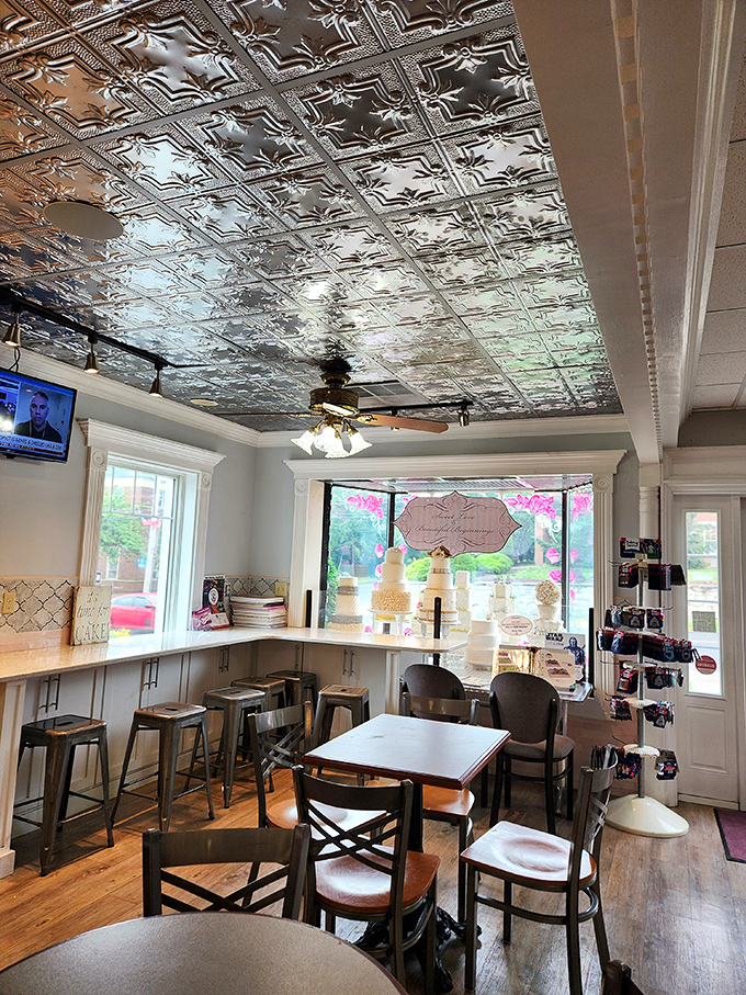 Beneath ornate tin ceiling tiles, this cozy seating area invites you to contemplate life's most important question: which dessert to try next?
