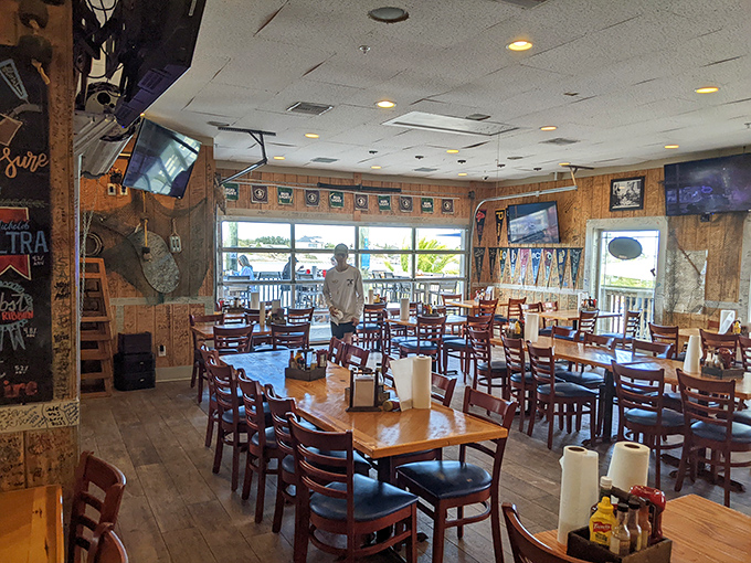 Inside Flora-Bama, wooden tables await hungry patrons while Gulf views remind you why you came to Florida in the first place.