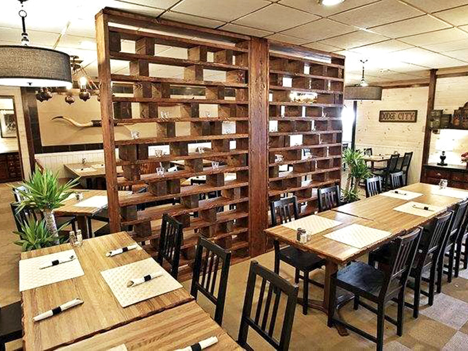 Wooden dividers create intimate dining spaces without sacrificing atmosphere. Like a well-designed Western town, every table feels like the best spot in the house.