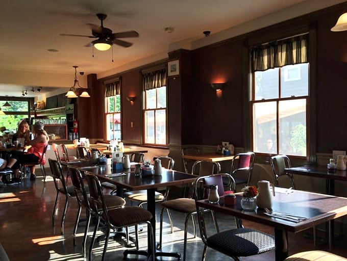 Dark walls and warm lighting create the perfect backdrop for serious breakfast conversations and life-changing meals.